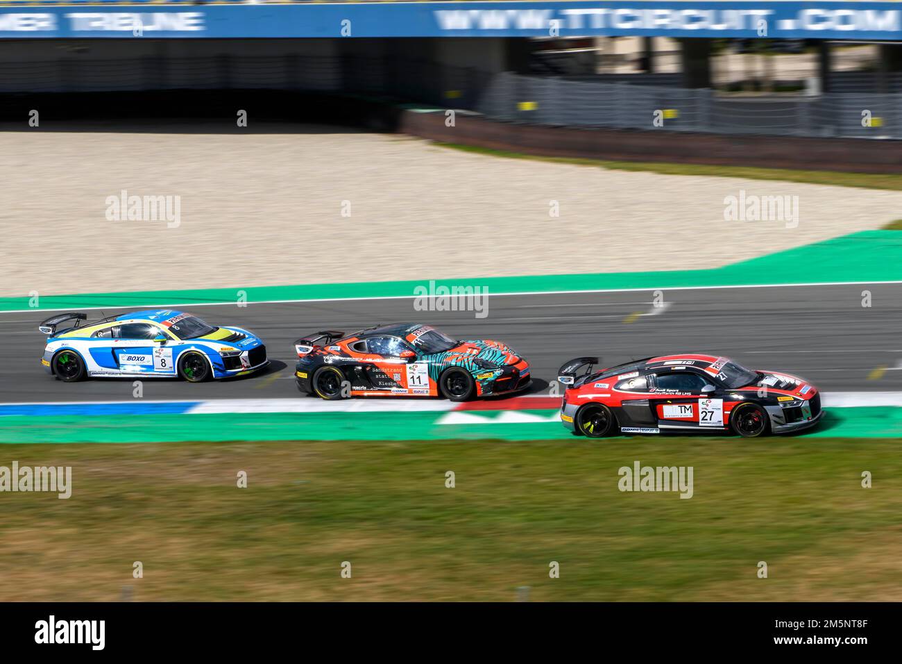 Three race cars sports car in the back front Audi R8 LMS GT4 with ...