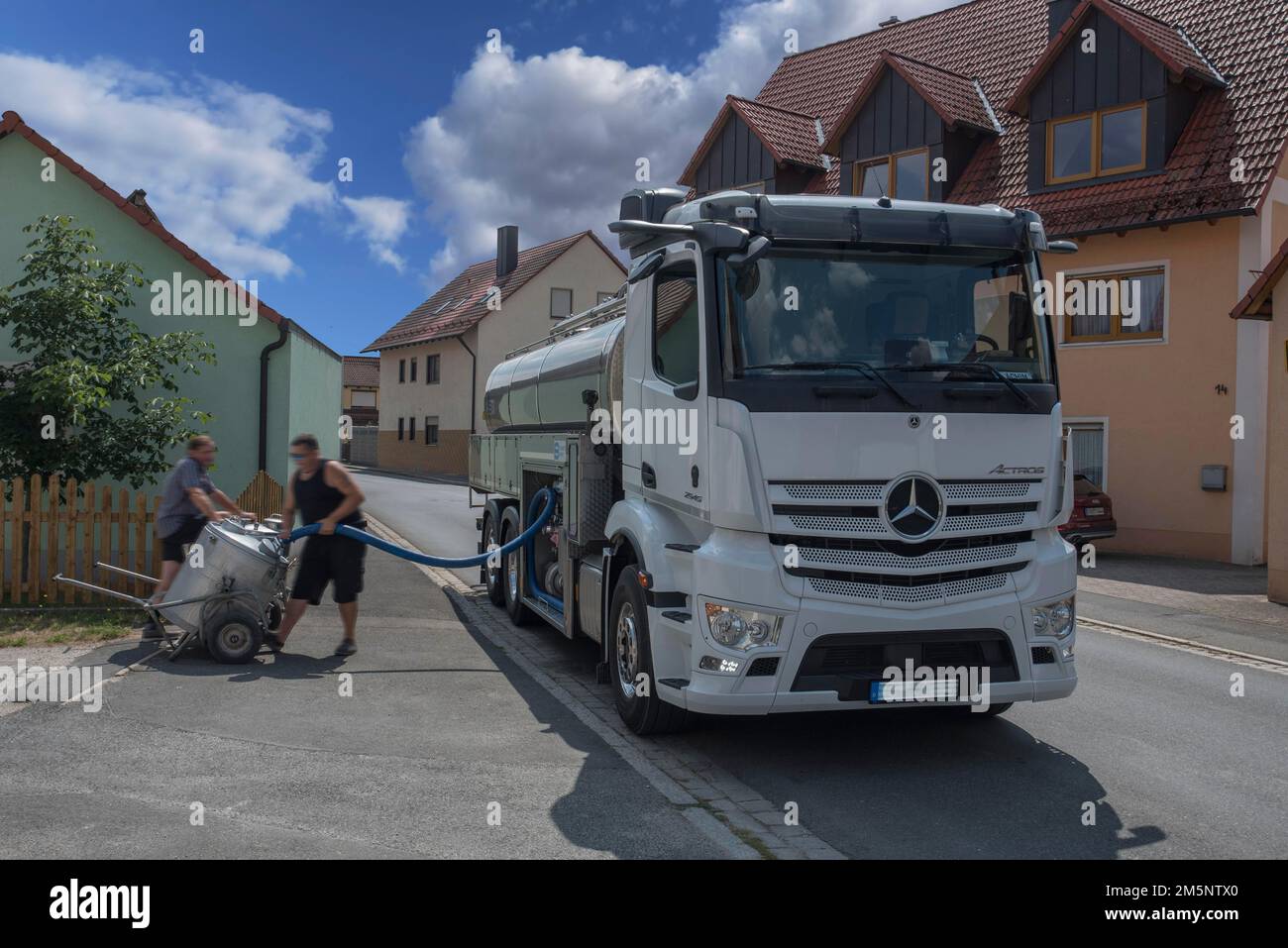 Milk collection by the dairy in a village, Bavaria, Germany Stock Photo ...