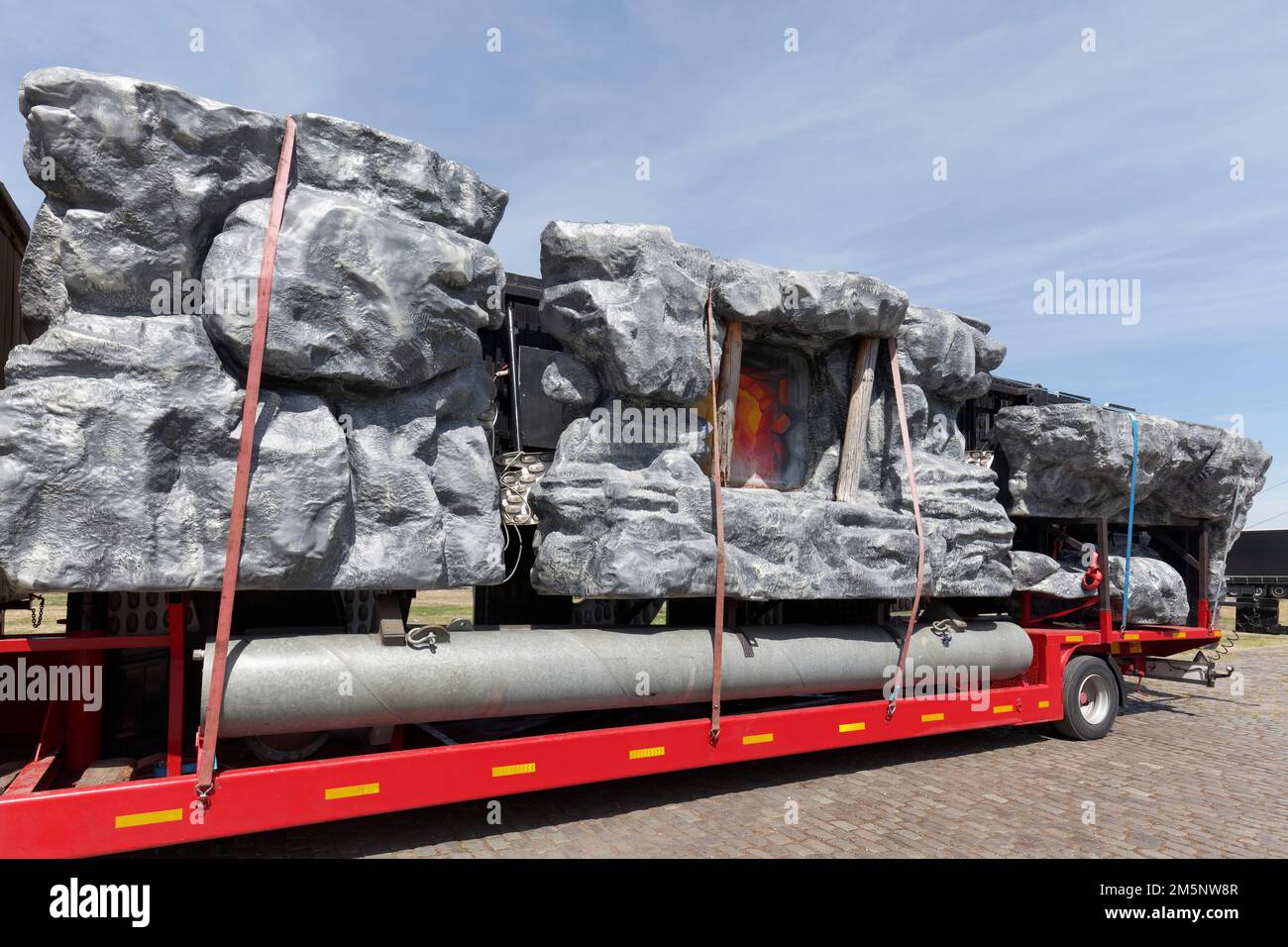 Truck semi-trailer, loaded with artificial rocks of an amusement ride ...