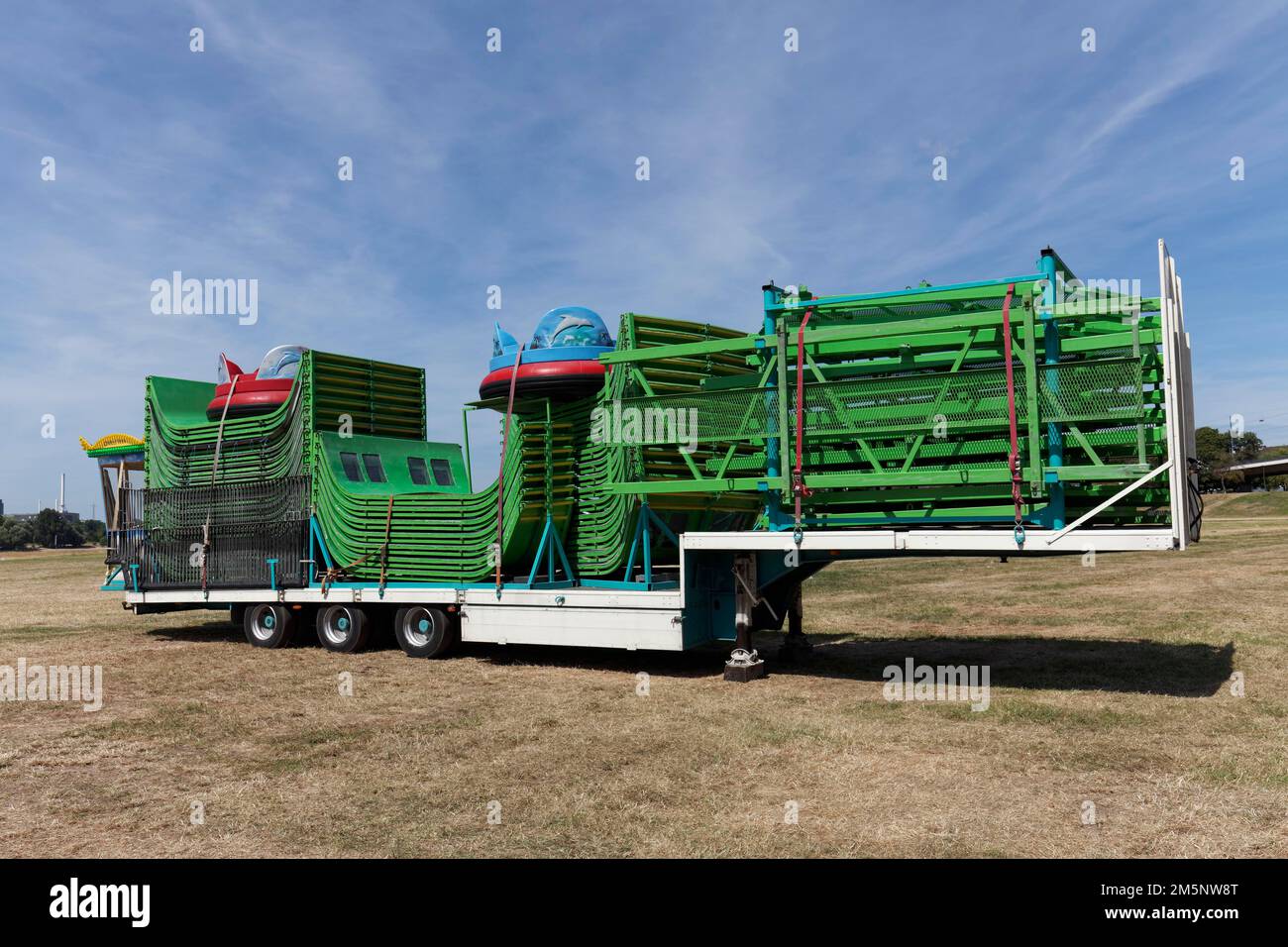 Truck semi-trailer, loaded with construction parts of a ride ...