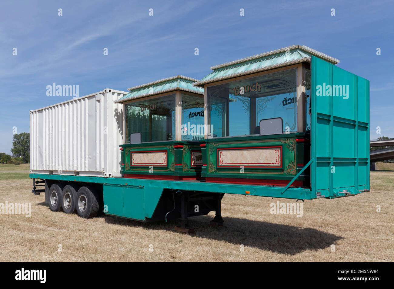 Truck semi-trailer, loaded with two ticket booths of an amusement ride ...