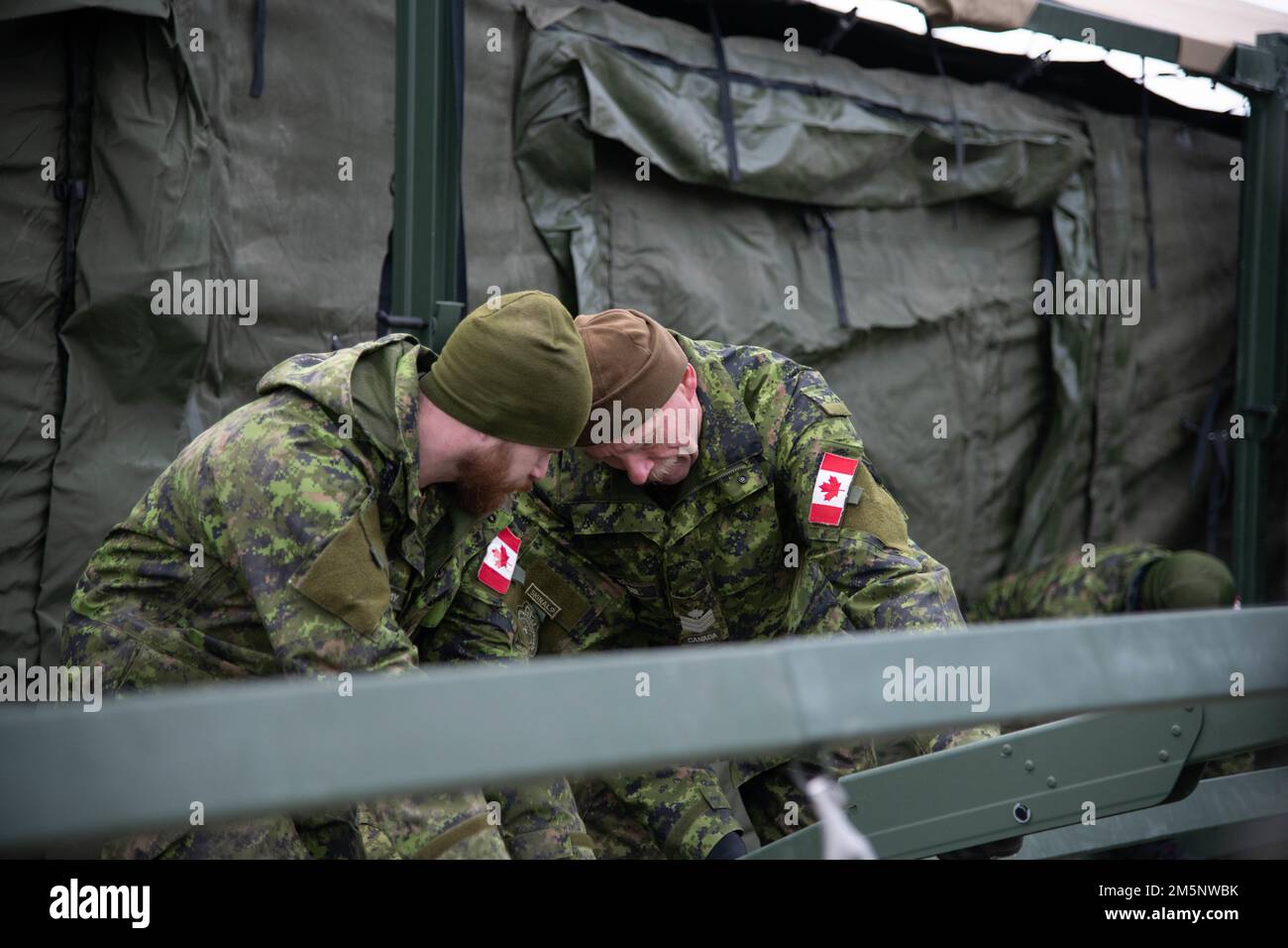 An advance party of Canadian Armed Forces members set up a Headquarters ...