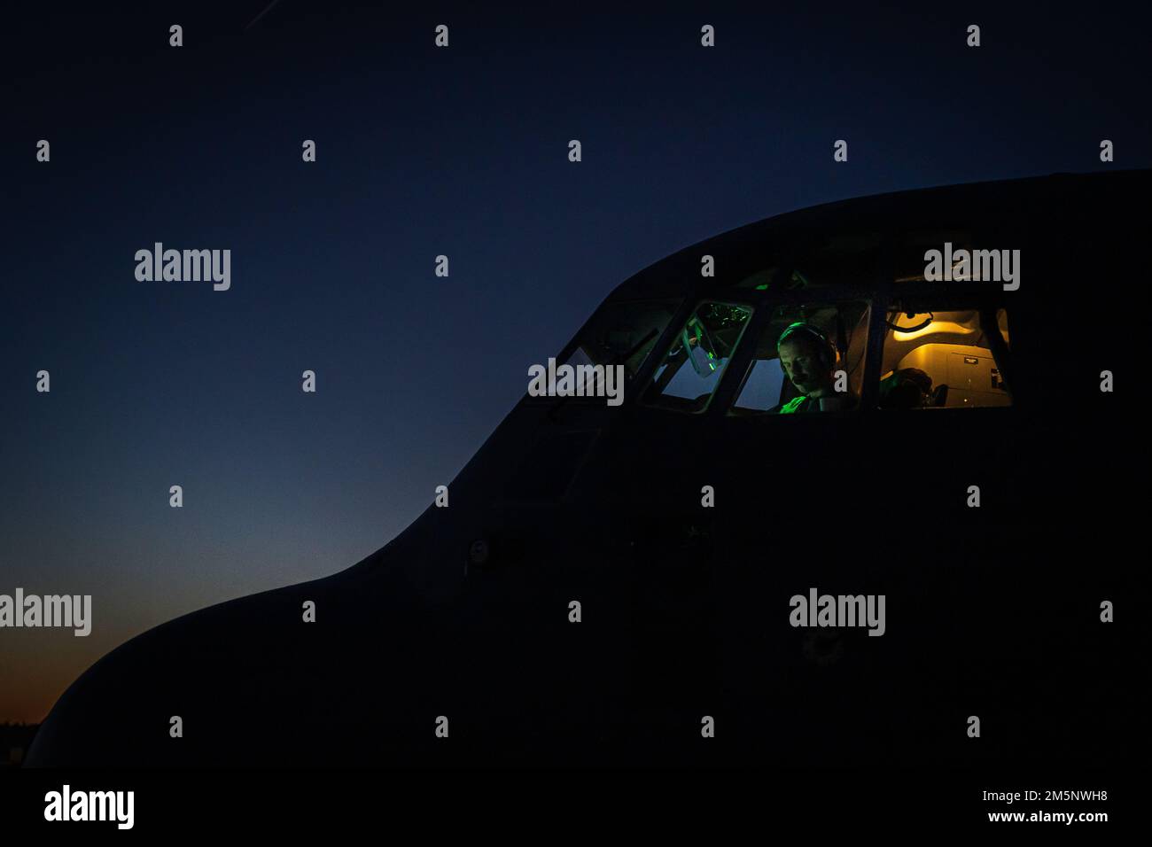A pilot assigned to the 37th Airlift Squadron conducts pre-flight ...