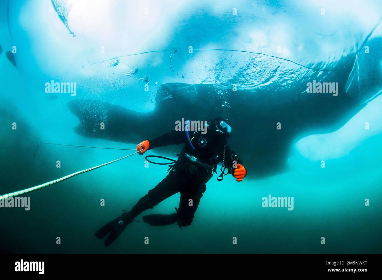 Scuba diver under the ice, Lake Baikal, Olkhon Island, Pribaikalsky ...