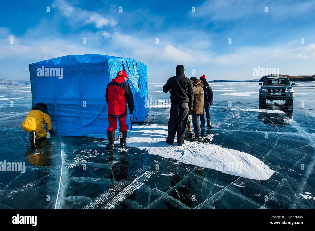 Group of scuba divers before a dive under ice, Lake Baikal, Olkhon ...