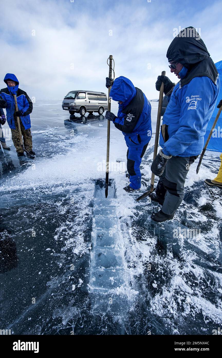 Digging a hole in ice for scuba divers, Lake Baikal, Pribaikalsky ...