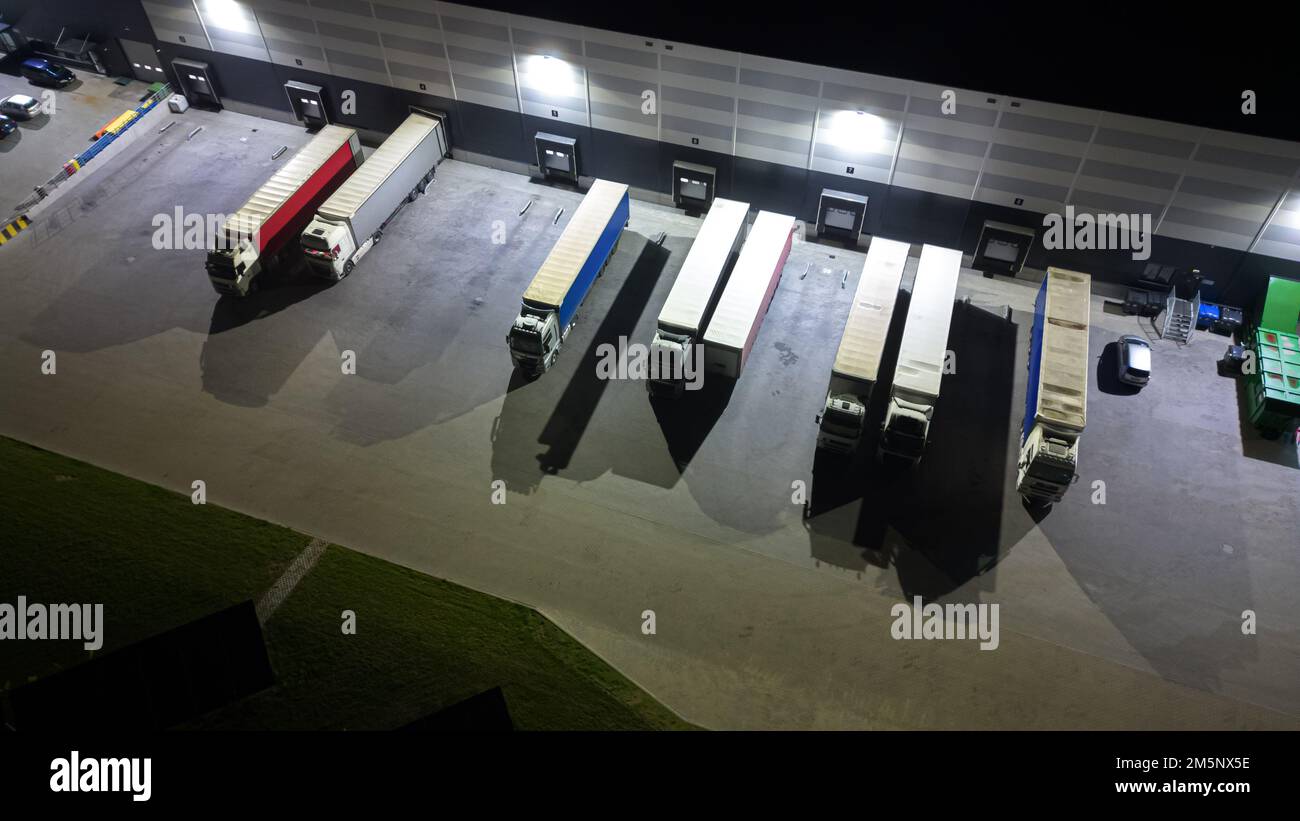 Aerial view of goods warehouse night. Logistics delivery; center in ...
