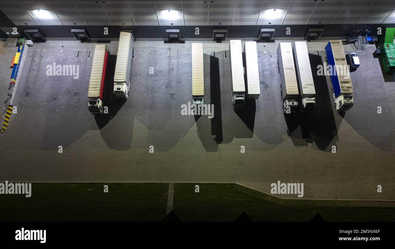 Night aerial view of a warehouse of goods for online stores. Logistic ...