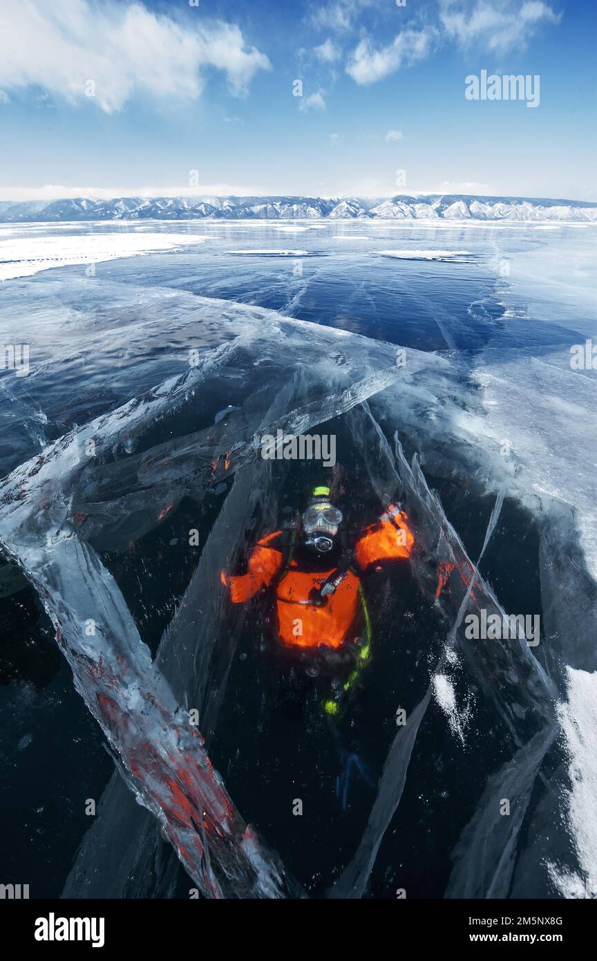 Scuba diver under ice, Lake Baikal, Pribaikalsky National Park, Irkutsk ...
