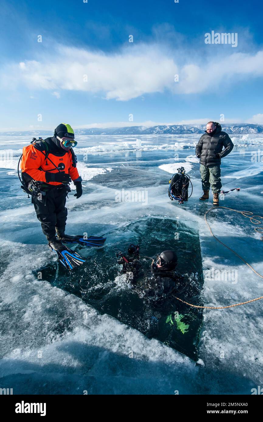 Scuba divers ready for an ice dive, Lake Baikal, Pribaikalsky National ...