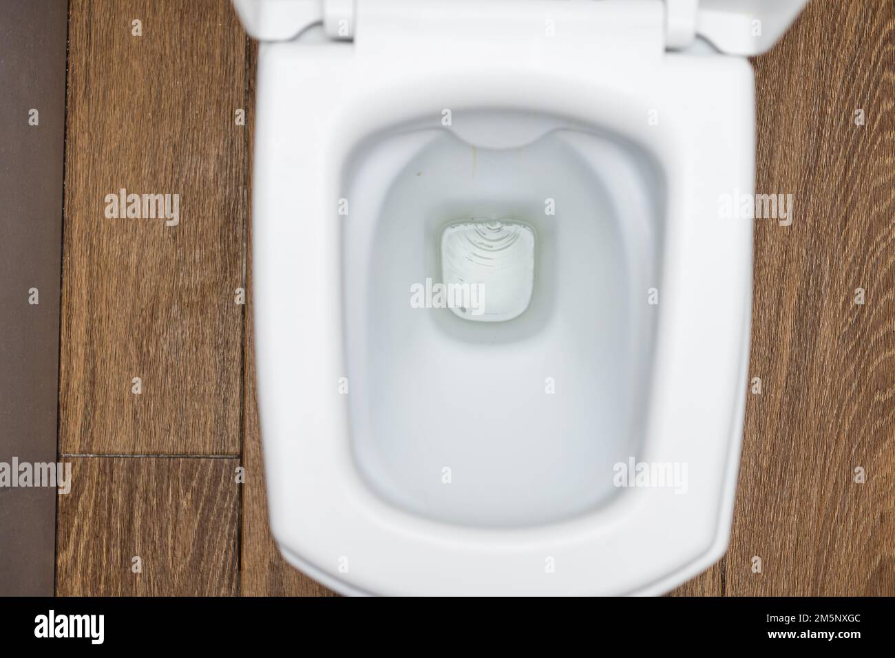 detail of a white toilet with the lid open in a public restroom Stock ...