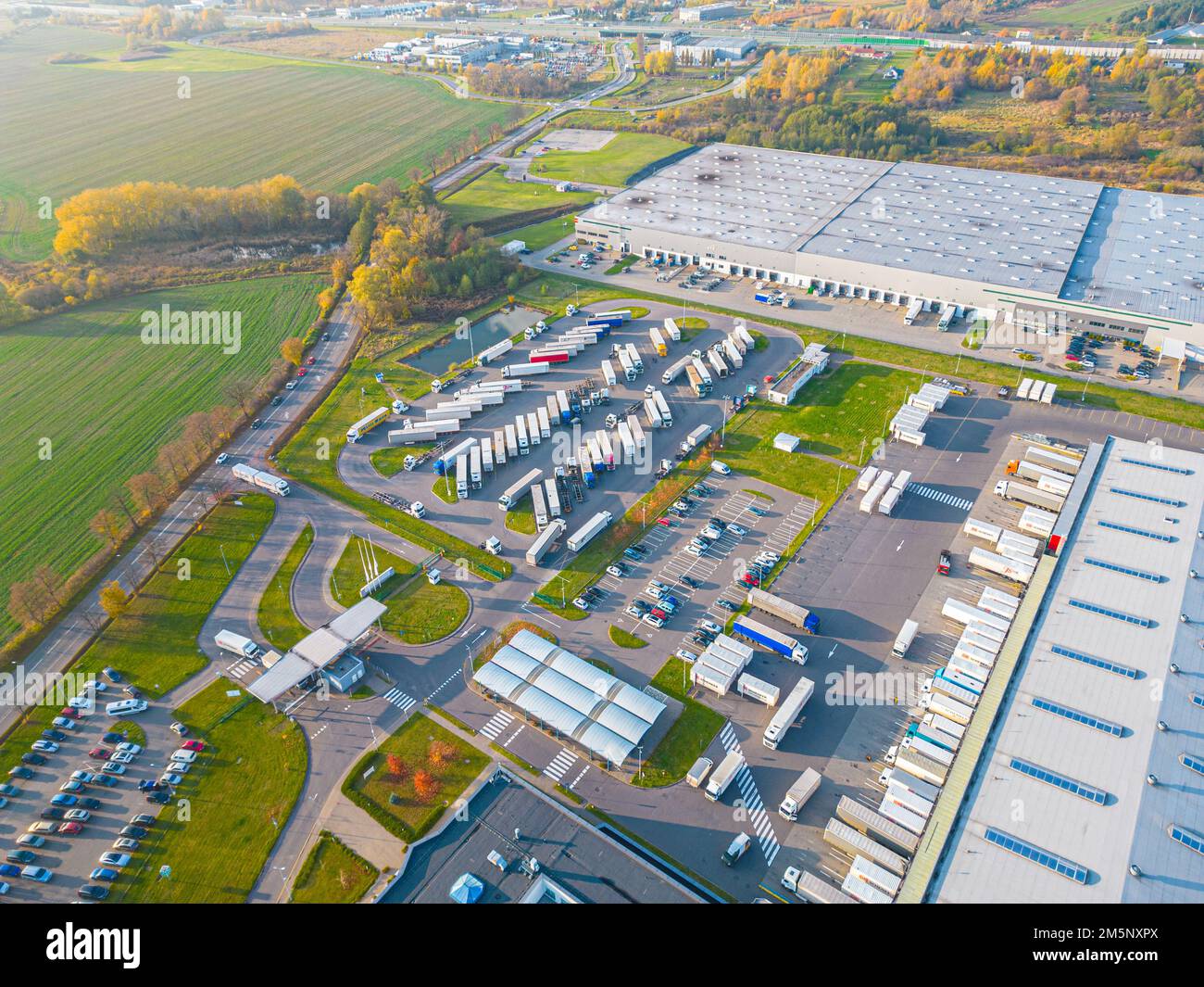 Aerial Shot of Industrial Warehouse Loading Dock where Many Truck with ...