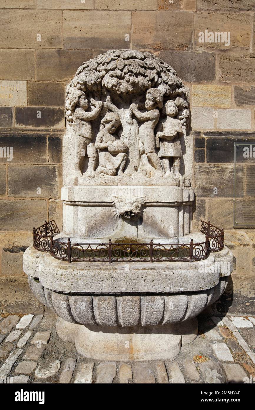 Guellbruennlein, fountain, stone relief with children under plum tree ...