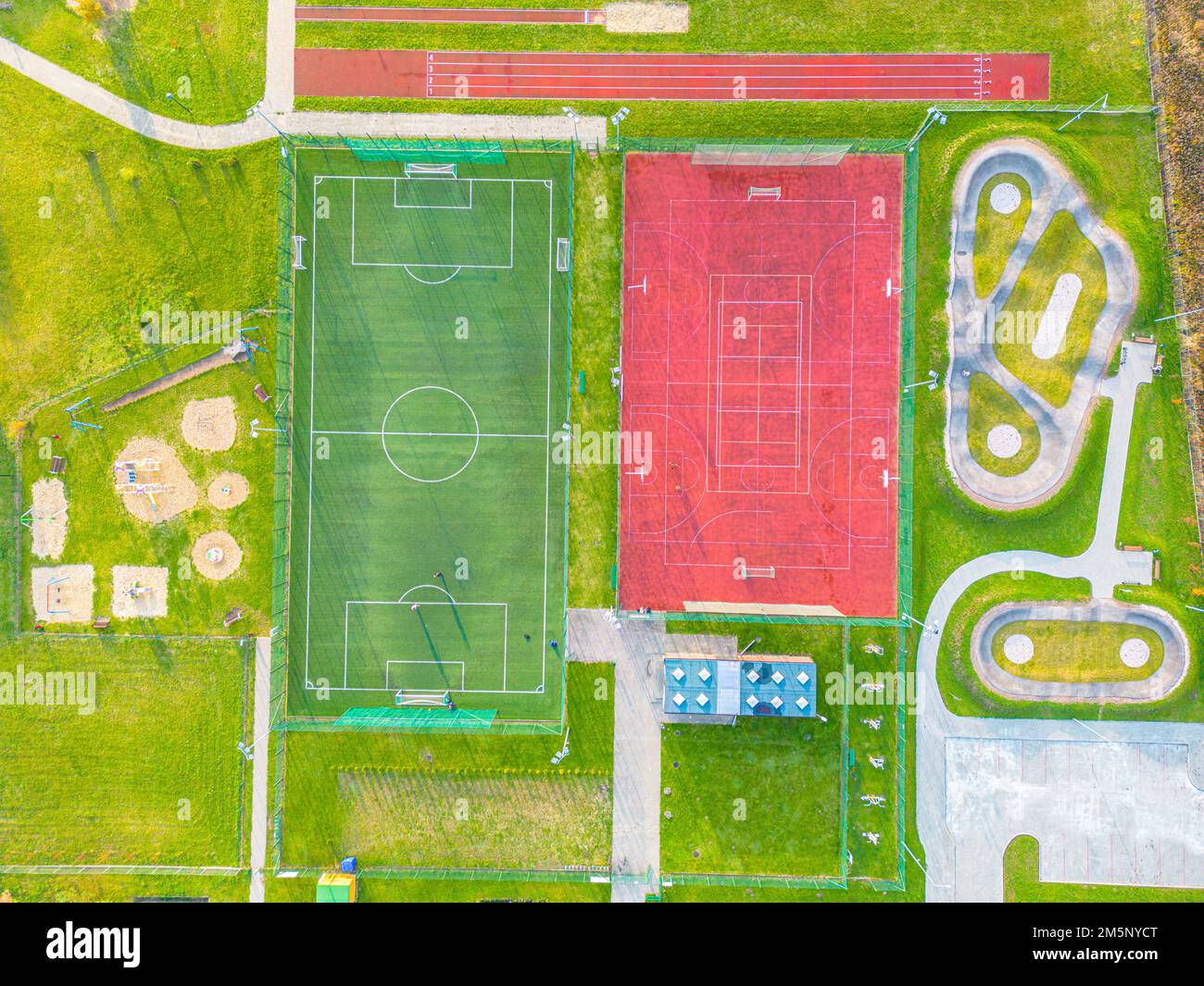 school sports ground with football stadium, jogging tracks around ...