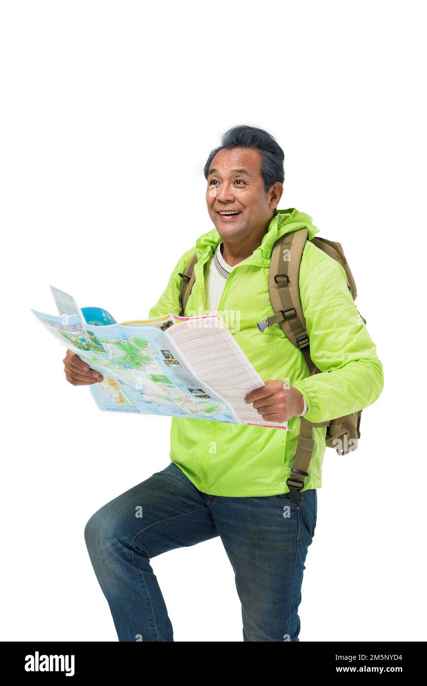 Happy with a map in the elderly Stock Photo - Alamy