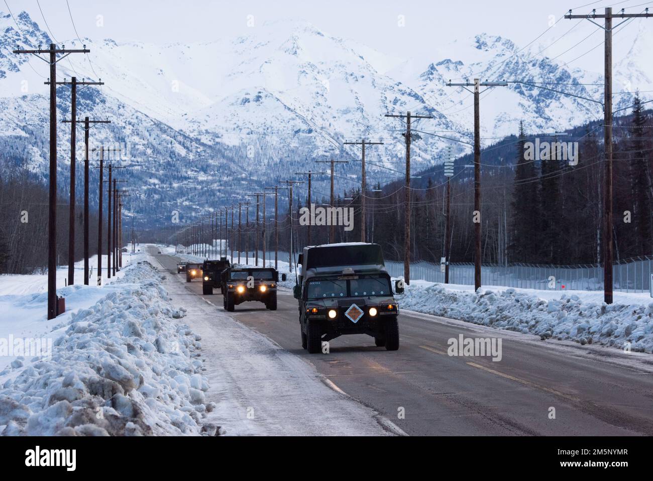 A convoy of military vehicles operated by Alaska Army National Guard ...