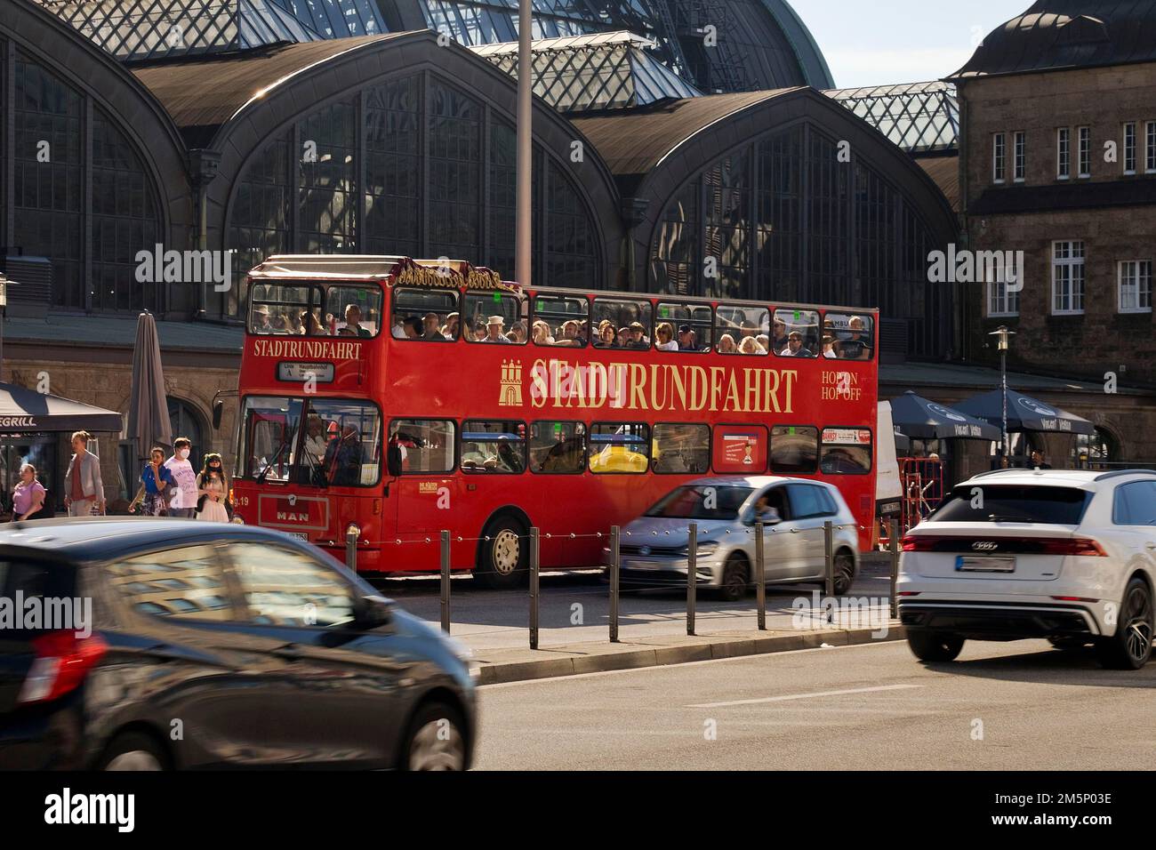 The red city tour double decker bus in front of the main station ...