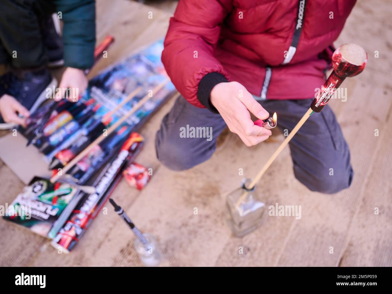 Berlin, Germany. 30th Dec, 2022. Two children light New Year's Eve ...
