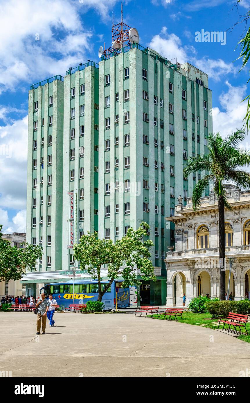 Cuban people walk in the Parque Leoncio Vidal in the downtown district ...