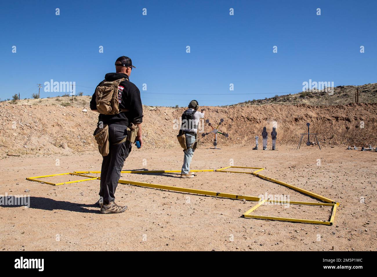 U.S. Marine Corps Sgt. Thomas Grimes, chief instructor, monitors the ...