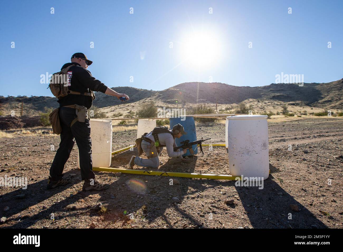 U.S. Marine Corps Sgt. Thomas Grimes, chief instructor, uses a shot ...