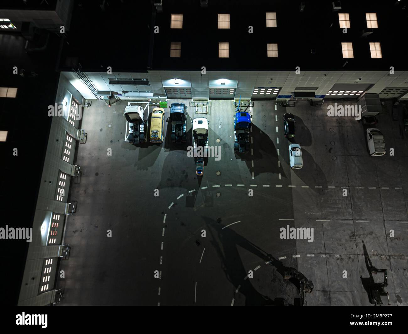 Night aerial view of a warehouse of goods for online stores. Logistic ...