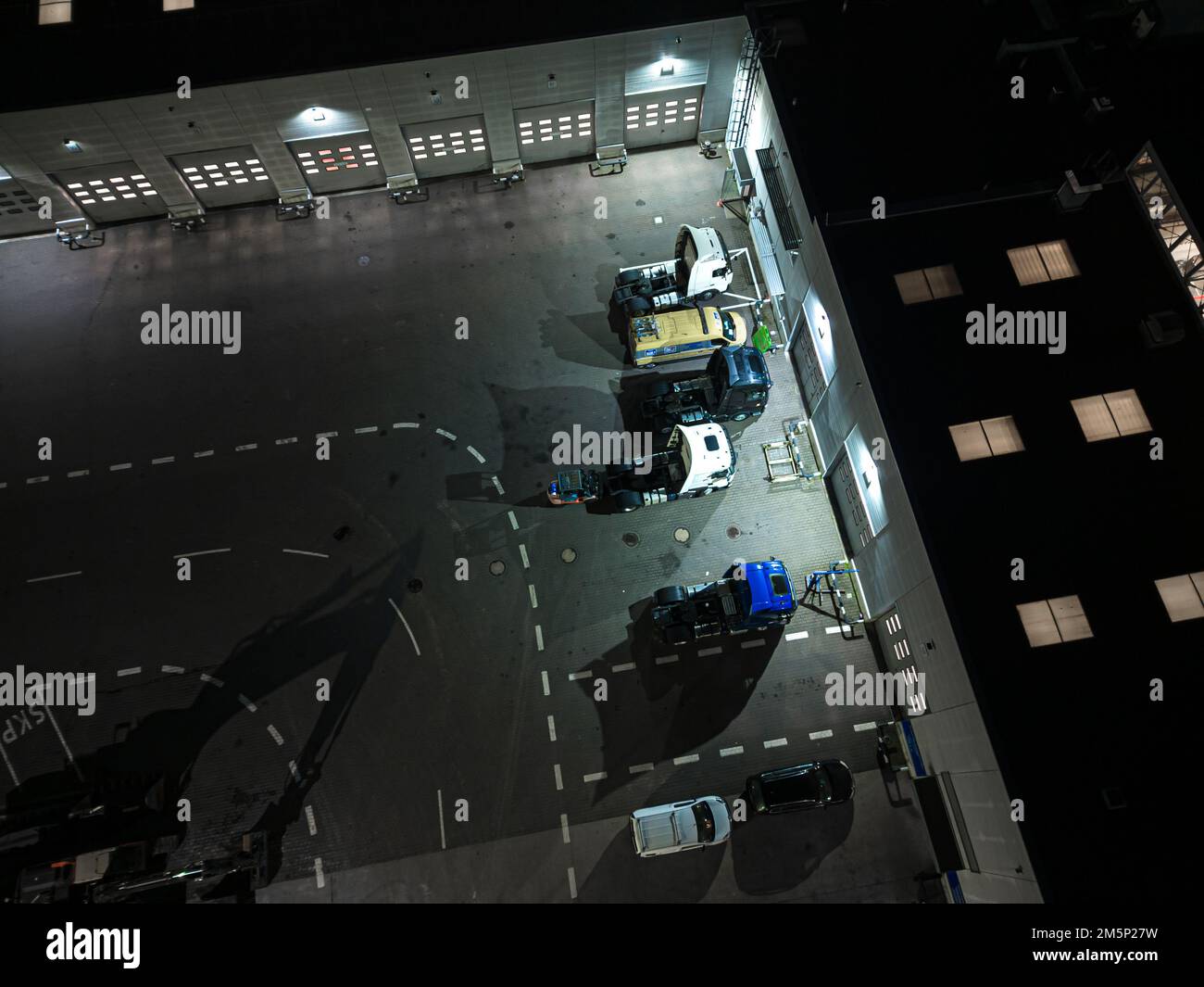 Night aerial view of a warehouse of goods for online stores. Logistic ...