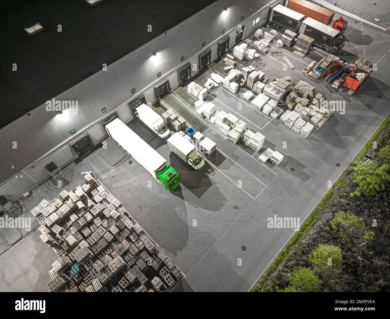Night aerial view of a warehouse of goods for online stores. Logistic ...