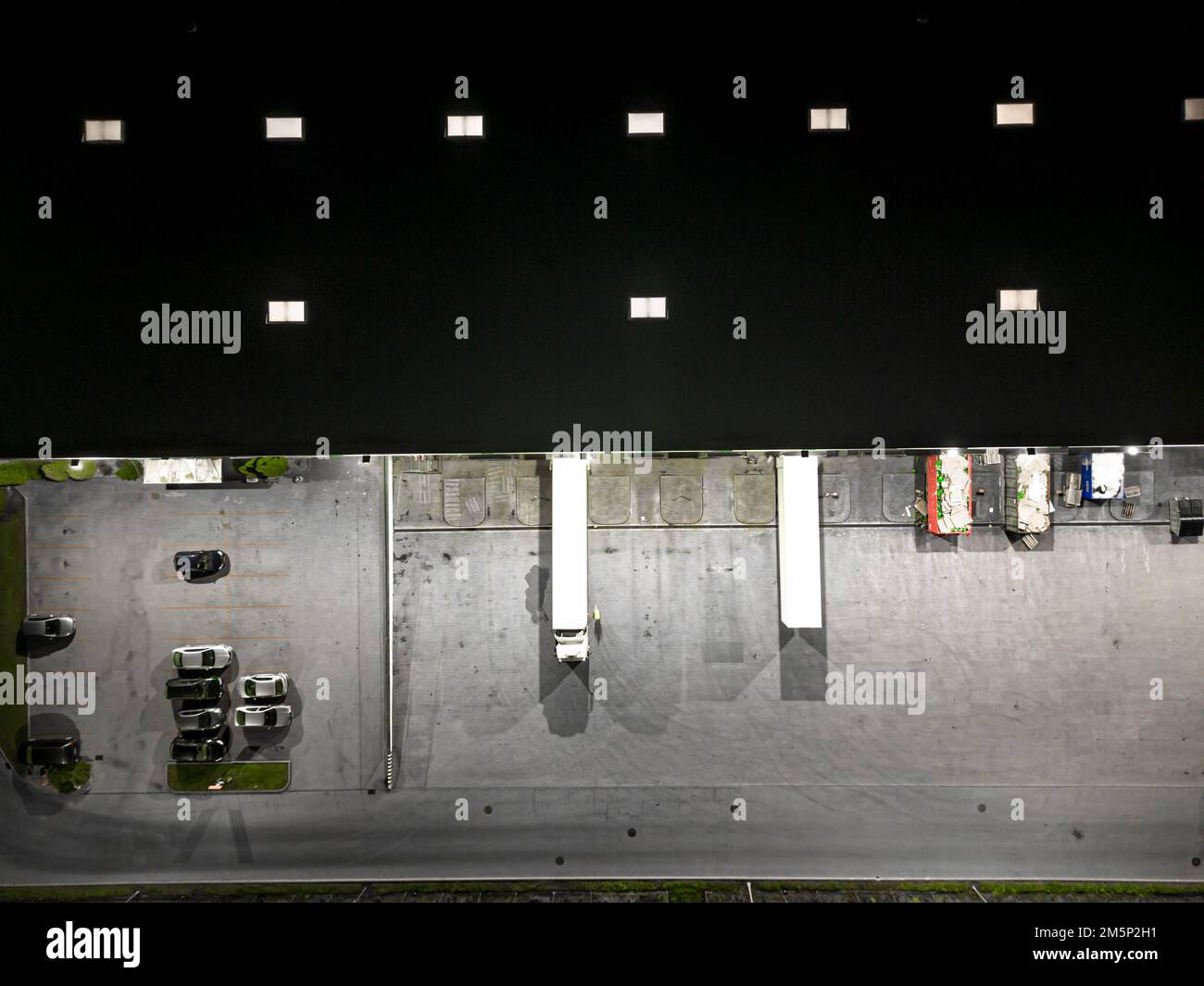 Night aerial view of a warehouse of goods for online stores. Logistic ...