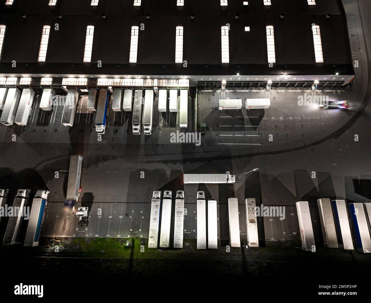 Night aerial view of a warehouse of goods for online stores. Logistic ...