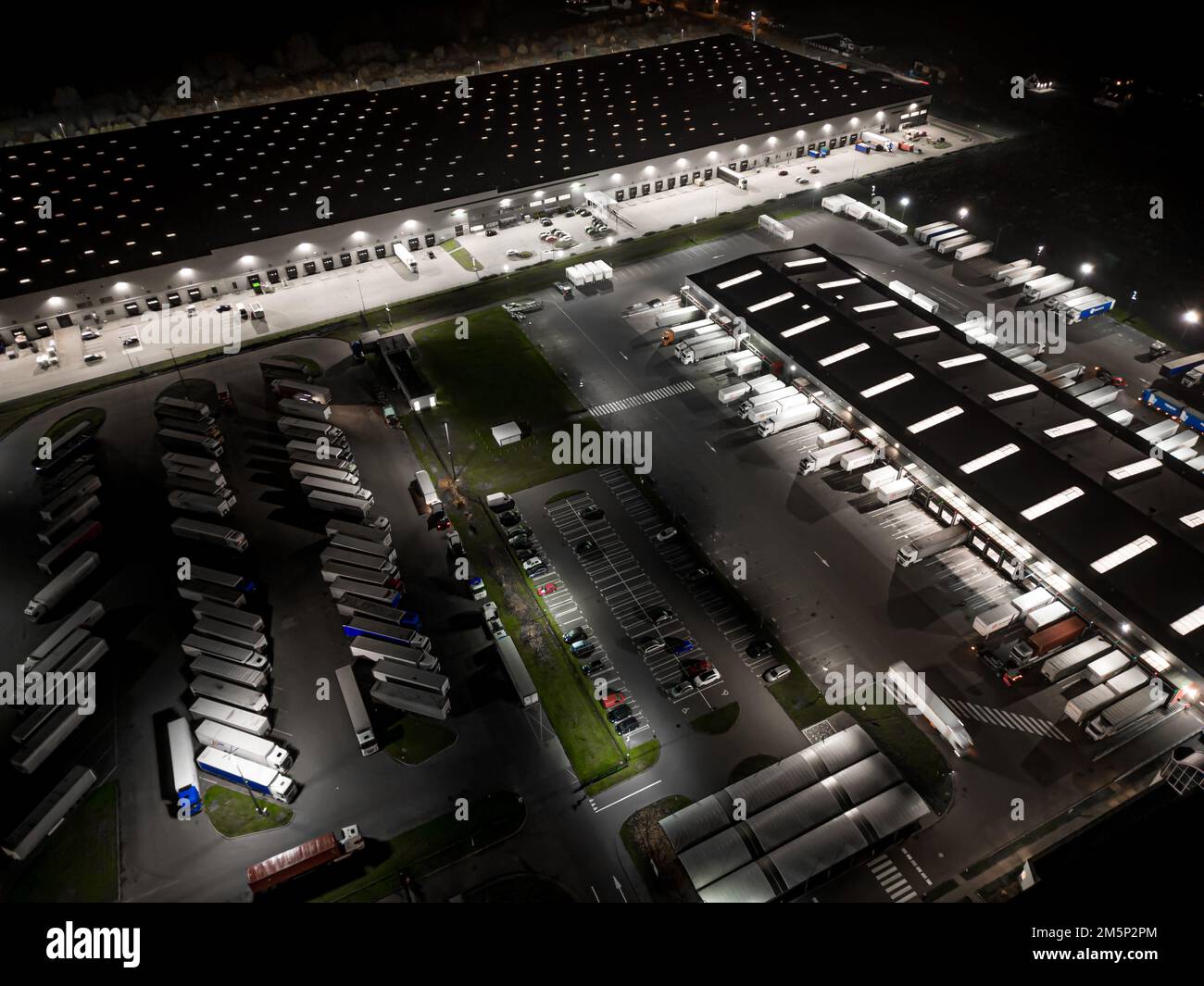 Night aerial view of a warehouse of goods for online stores. Logistic ...