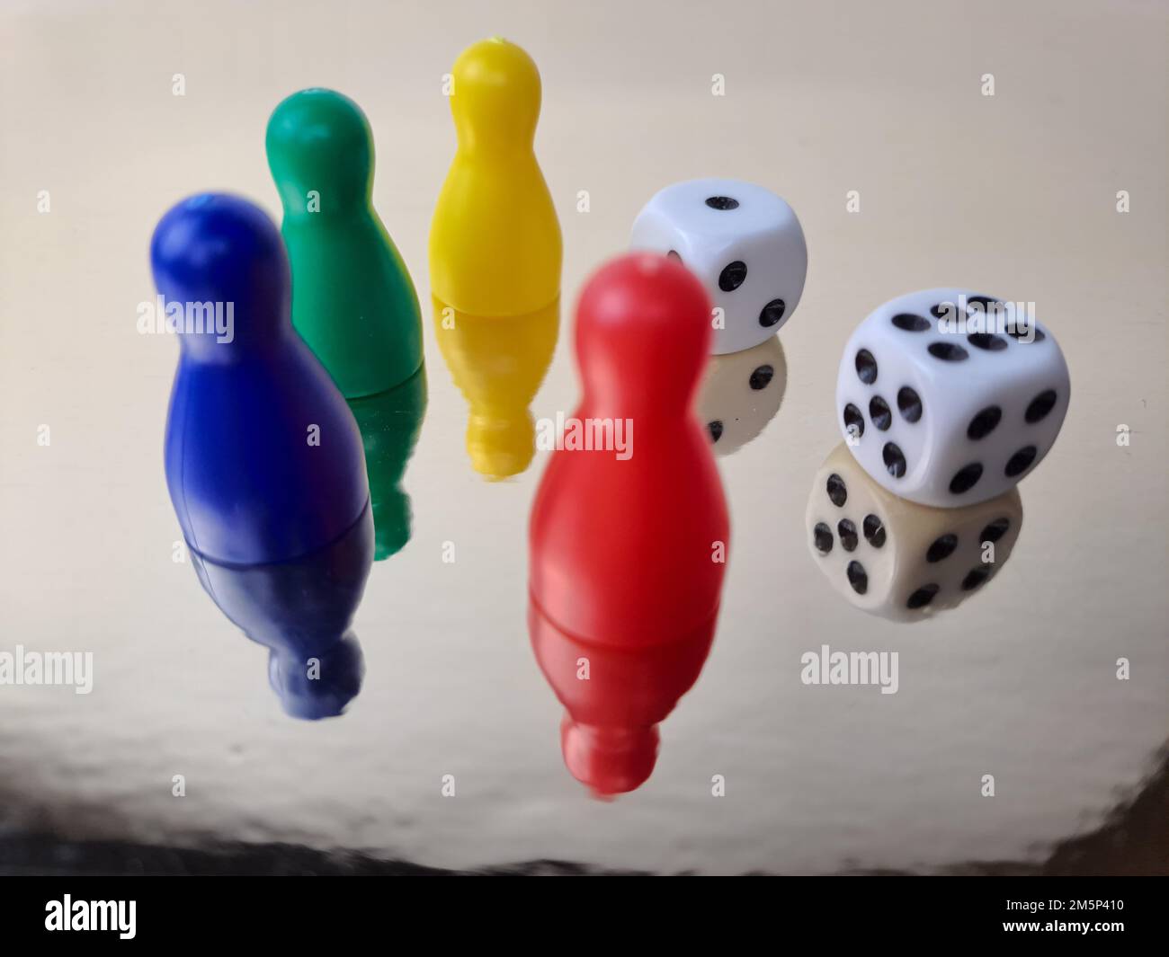 Board Game Pawns And Dice With Colored Pieces Stock Photo - Alamy