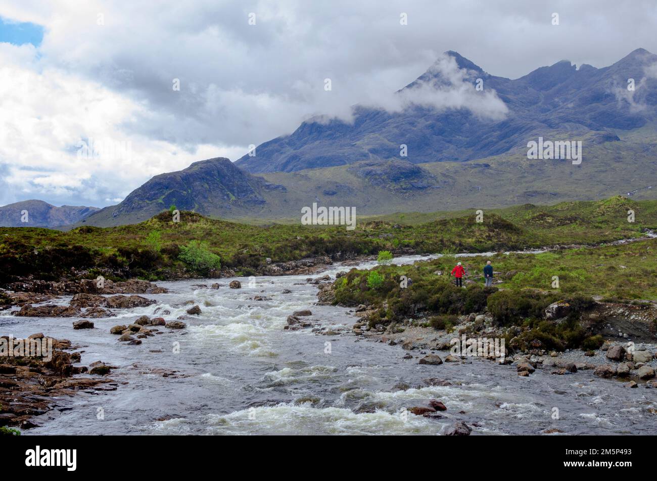 An elderly couple walk beneath the peaks of Sgurr nan Gillean (965m ...