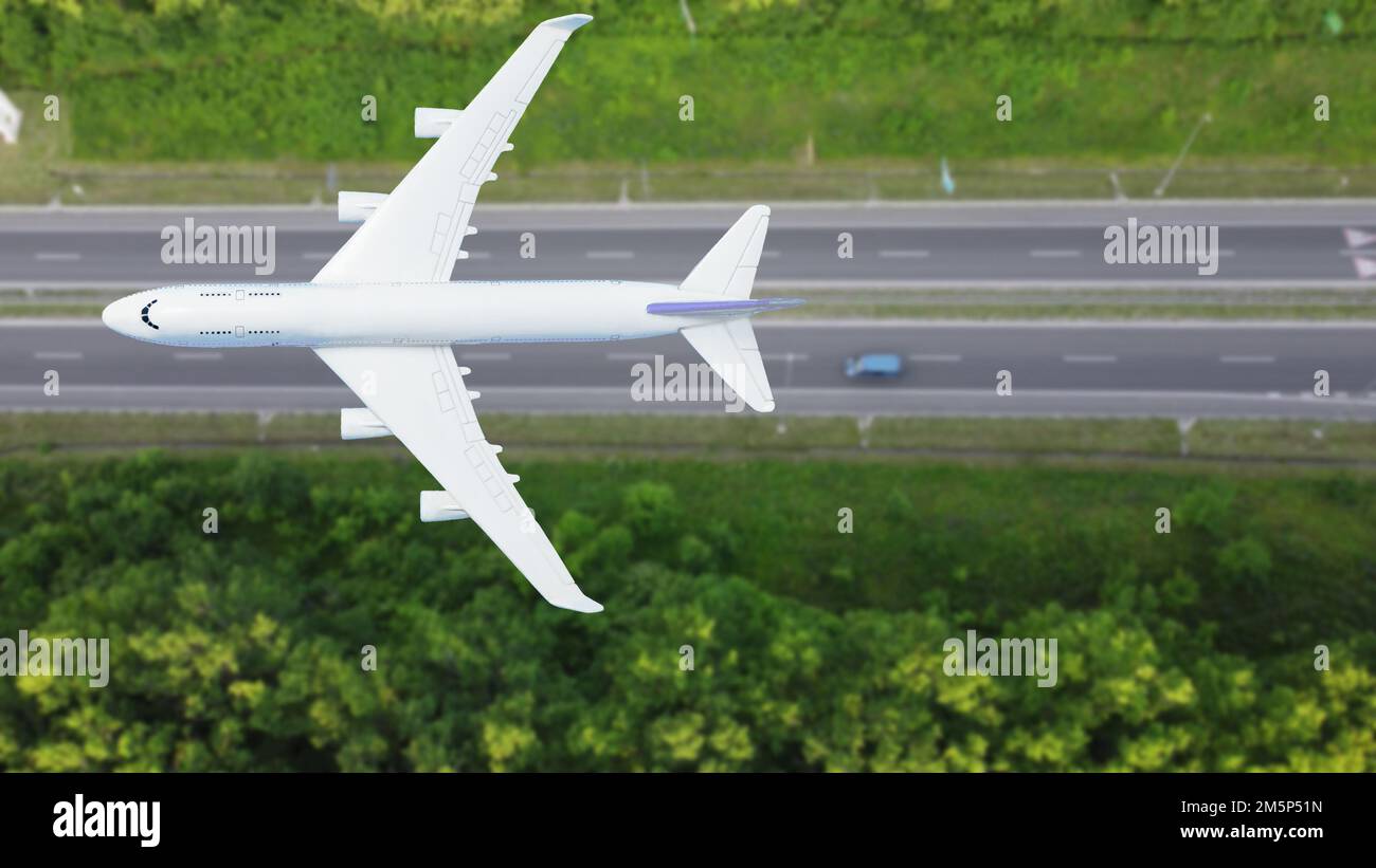 plane flies above the landscape. Side view of aircraft. Travel and ...