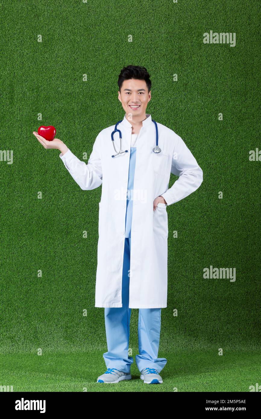 The grass young male doctor Stock Photo - Alamy
