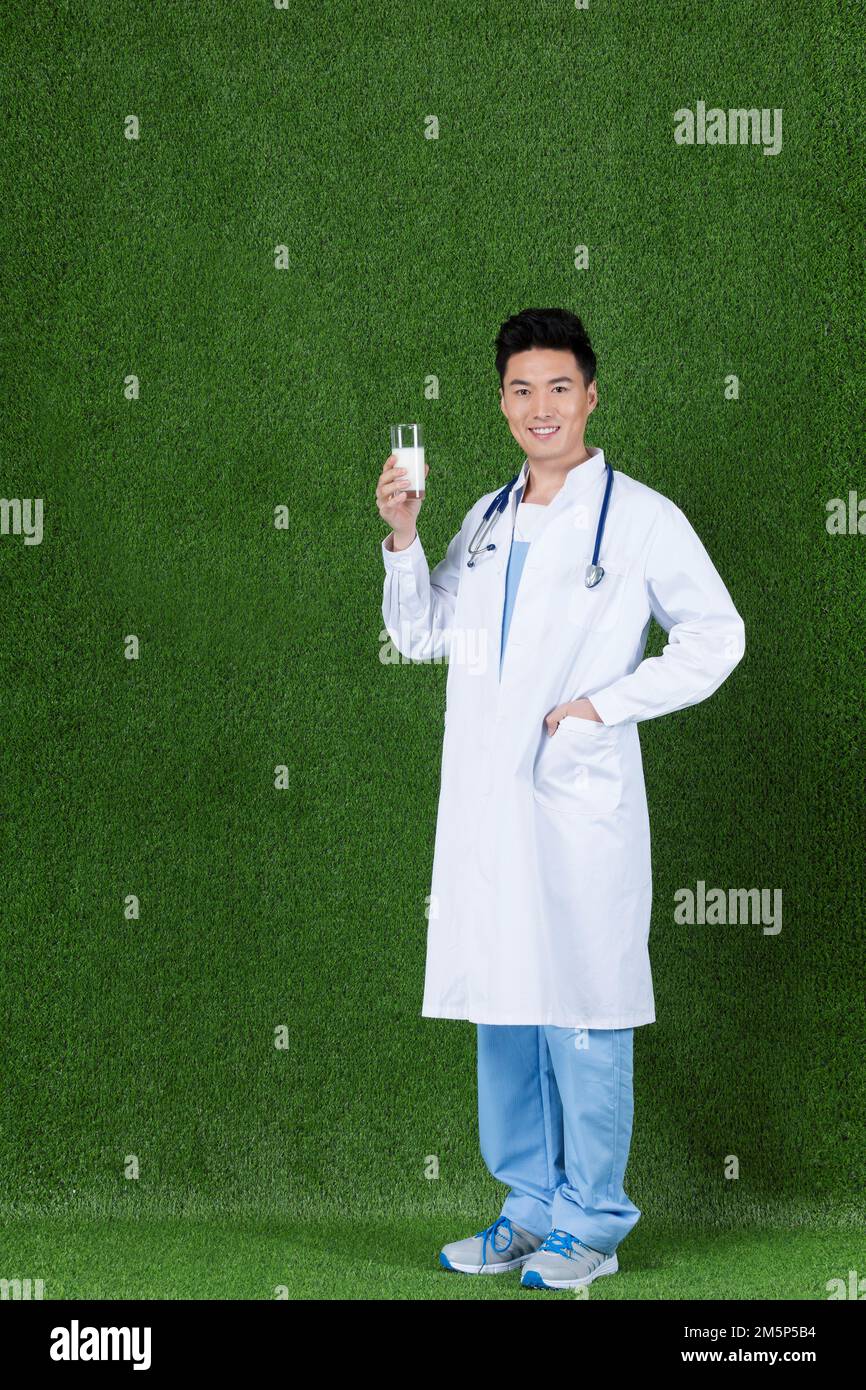 Grassland youth male doctor with milk Stock Photo - Alamy