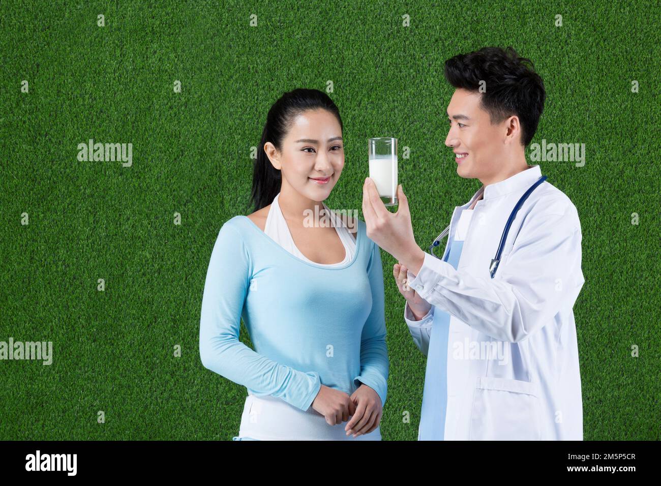 Grass male doctors to patients with milk Stock Photo - Alamy