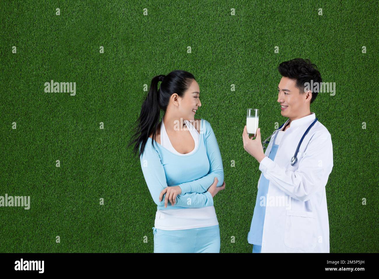 Grass male doctors to patients with milk Stock Photo - Alamy