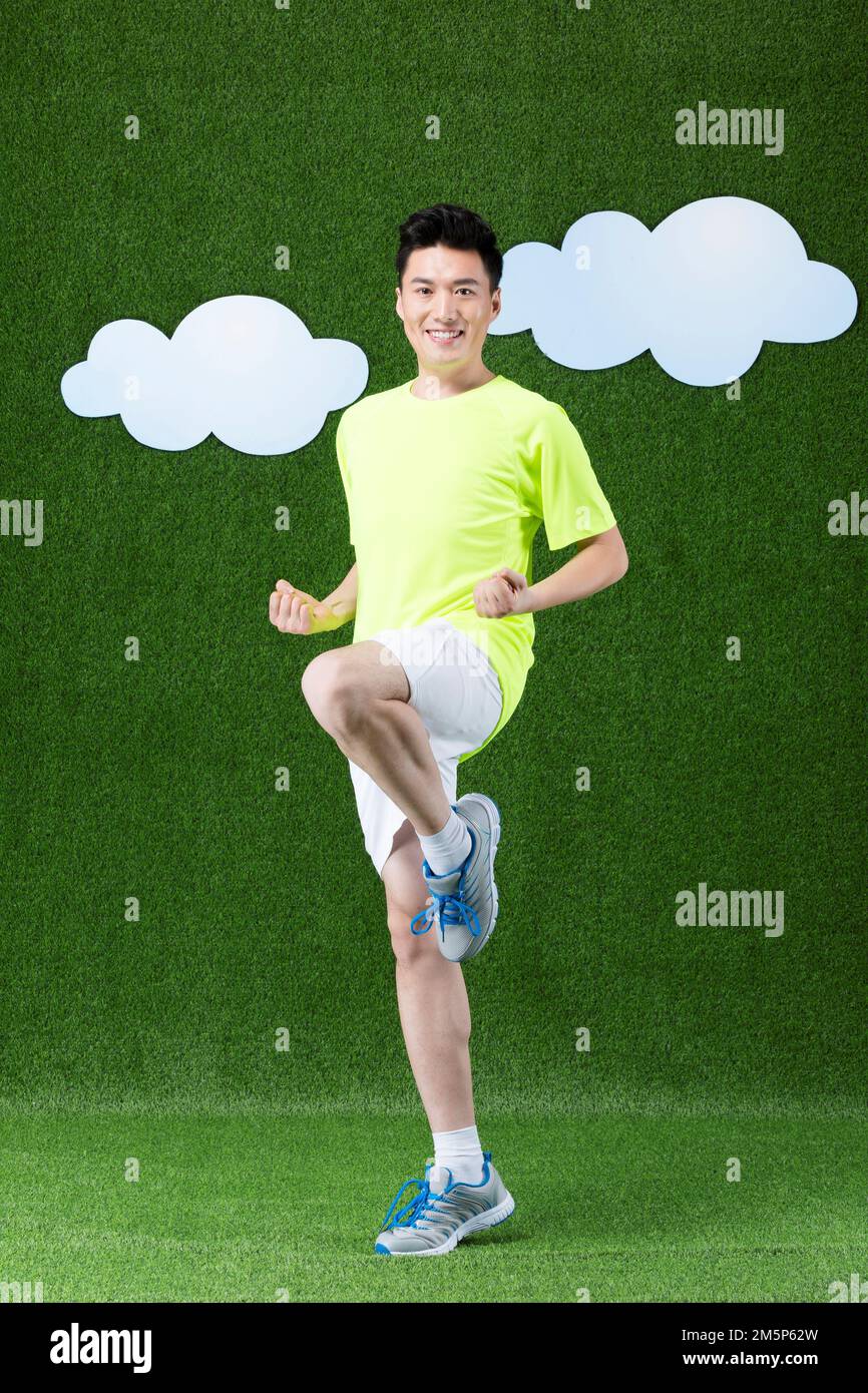 Man physical exercise on grass hi-res stock photography and images - Alamy
