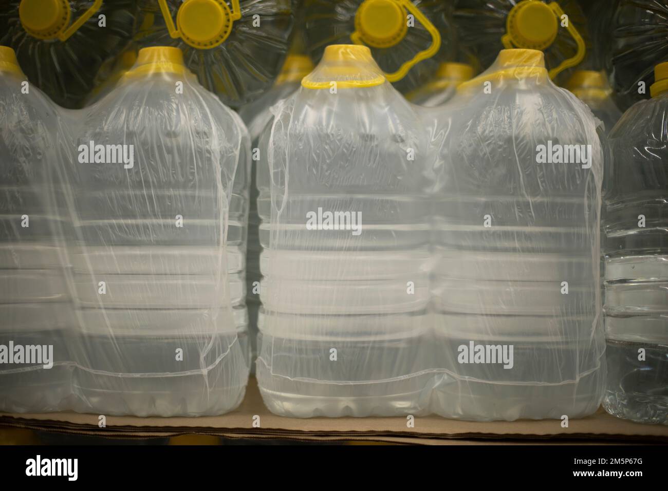 Bottles of water in film. Sale of drinking water. Canisters with fresh ...
