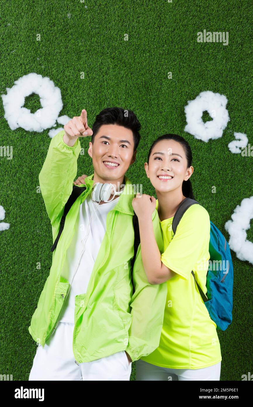The grass creative young lovers outdoor outing Stock Photo - Alamy