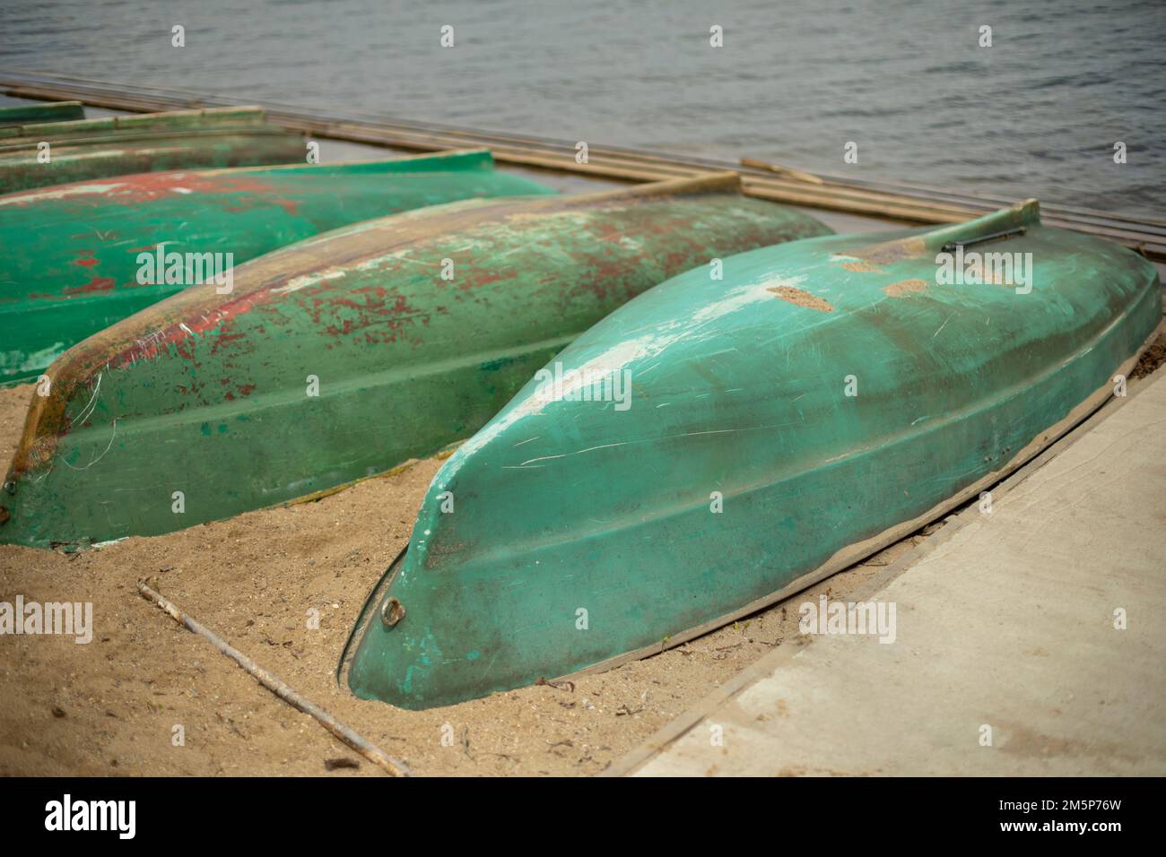 Old boats are overturned on shore. Boat station. Boats are drying up ...