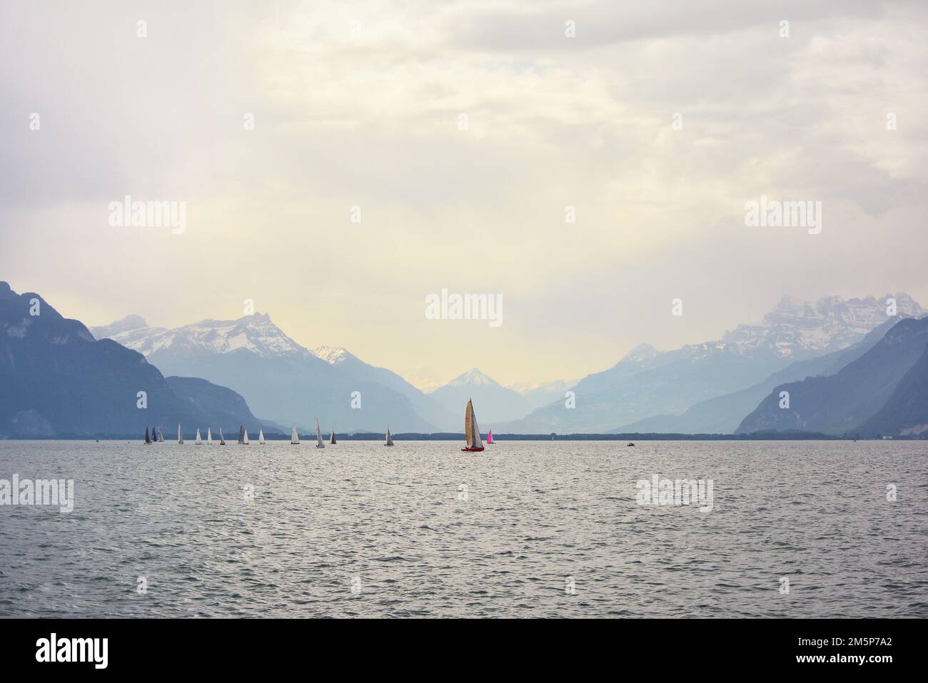 Boats on the Lake Leman with the swiss Alps in the background. Vevey ...