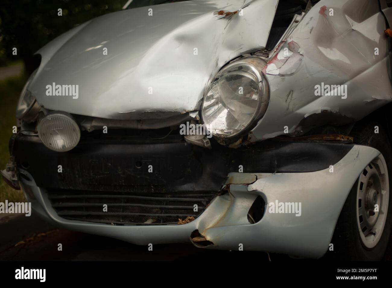 Broken car. Small car after accident. Crumpled bumper. Transport after ...