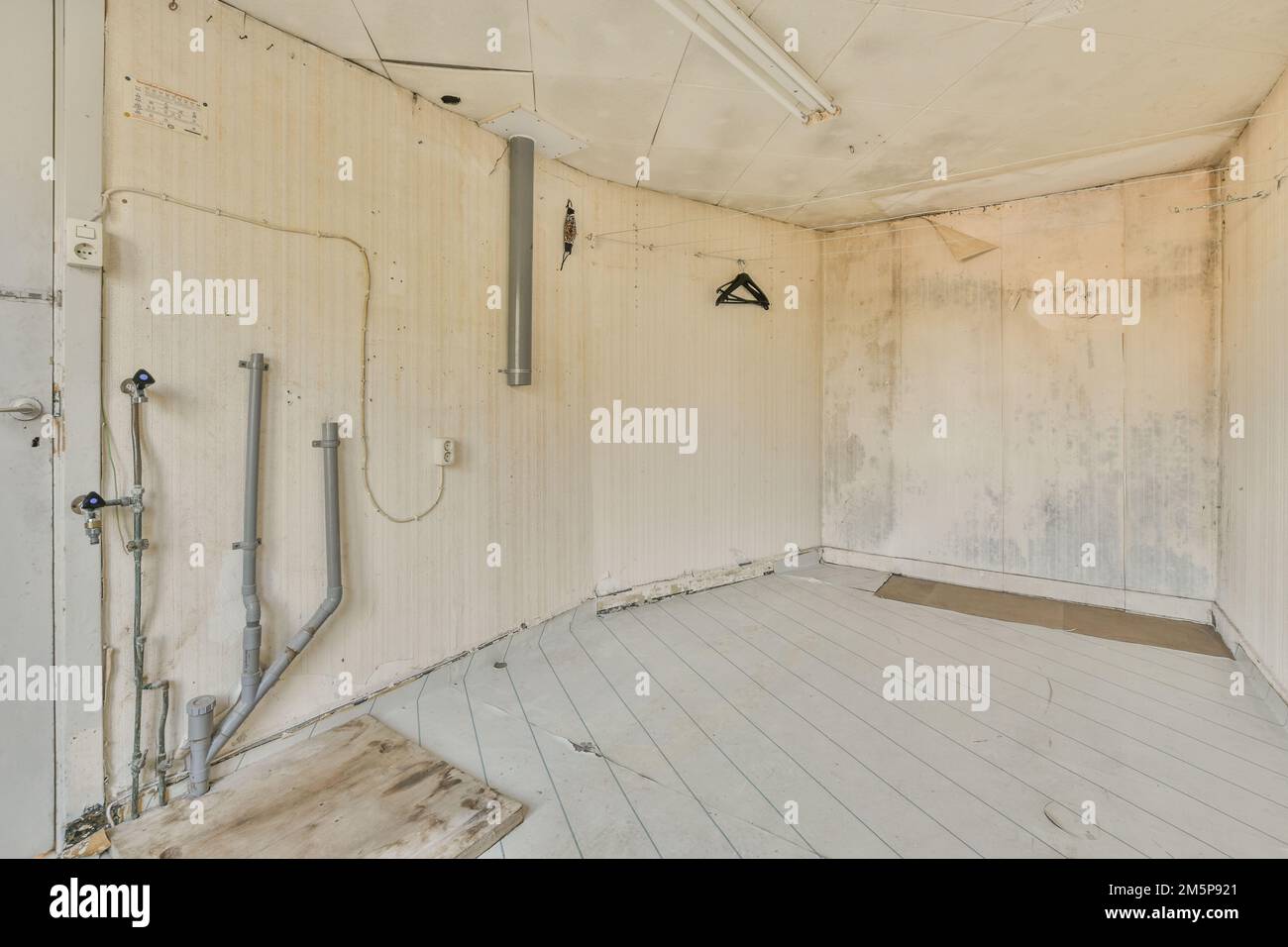 an unfinished room with wood flooring and white paint on the walls that ...