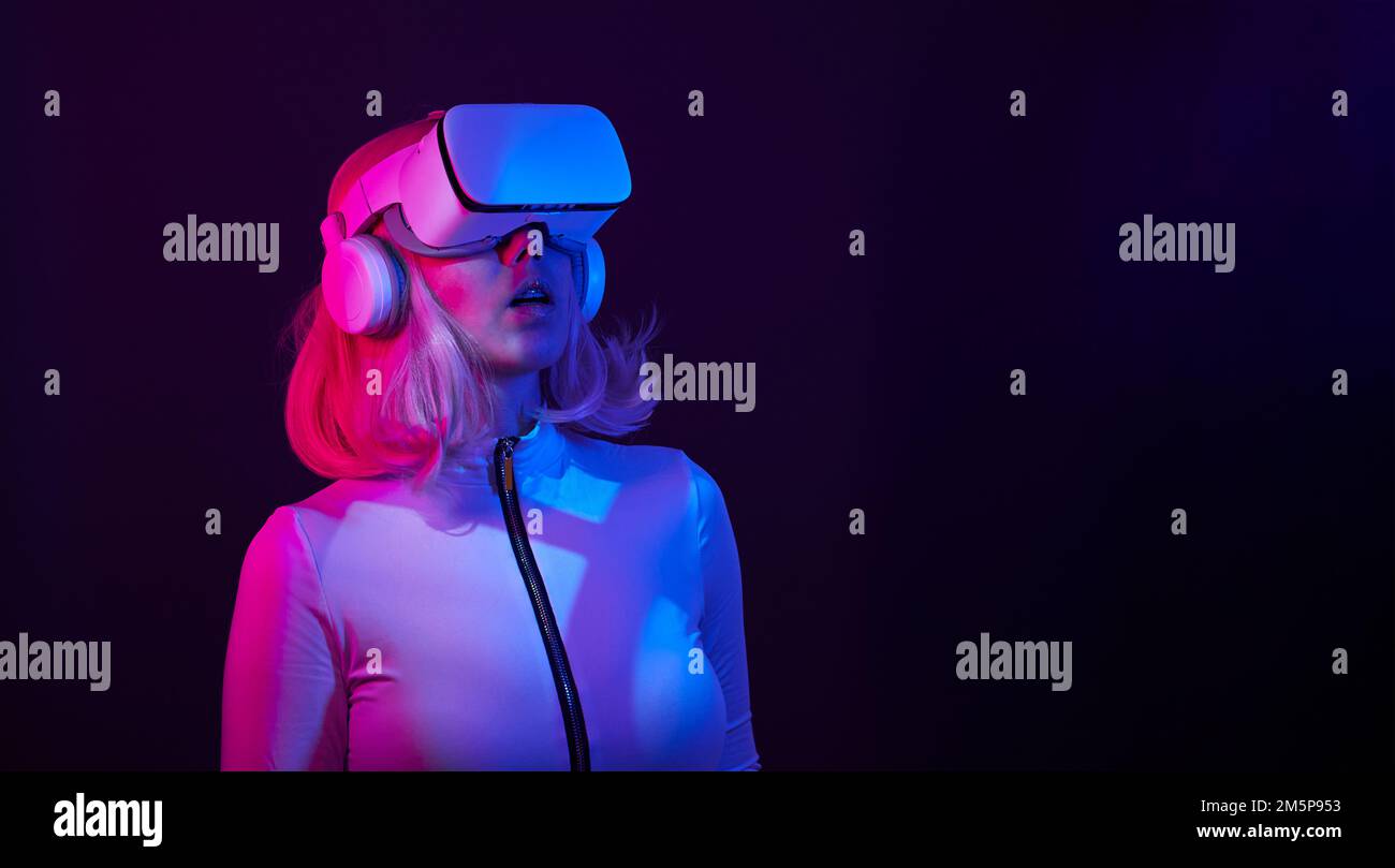 Woman in virtual reality goggle in neon colors. Concept of future ...