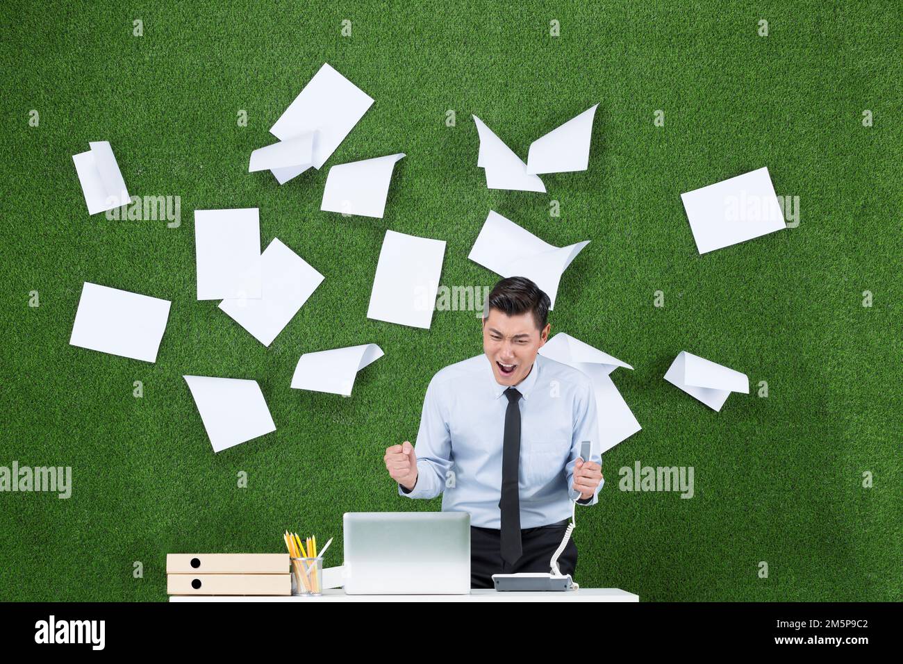 The grass business men throw paper into the air Stock Photo - Alamy