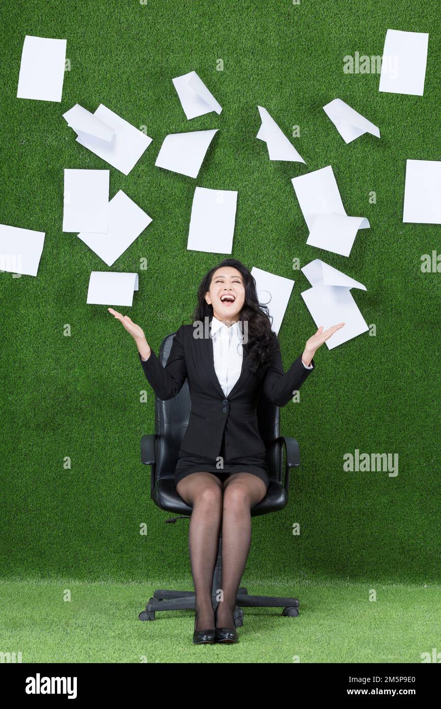 Ms grass business paper thrown into the air Stock Photo - Alamy