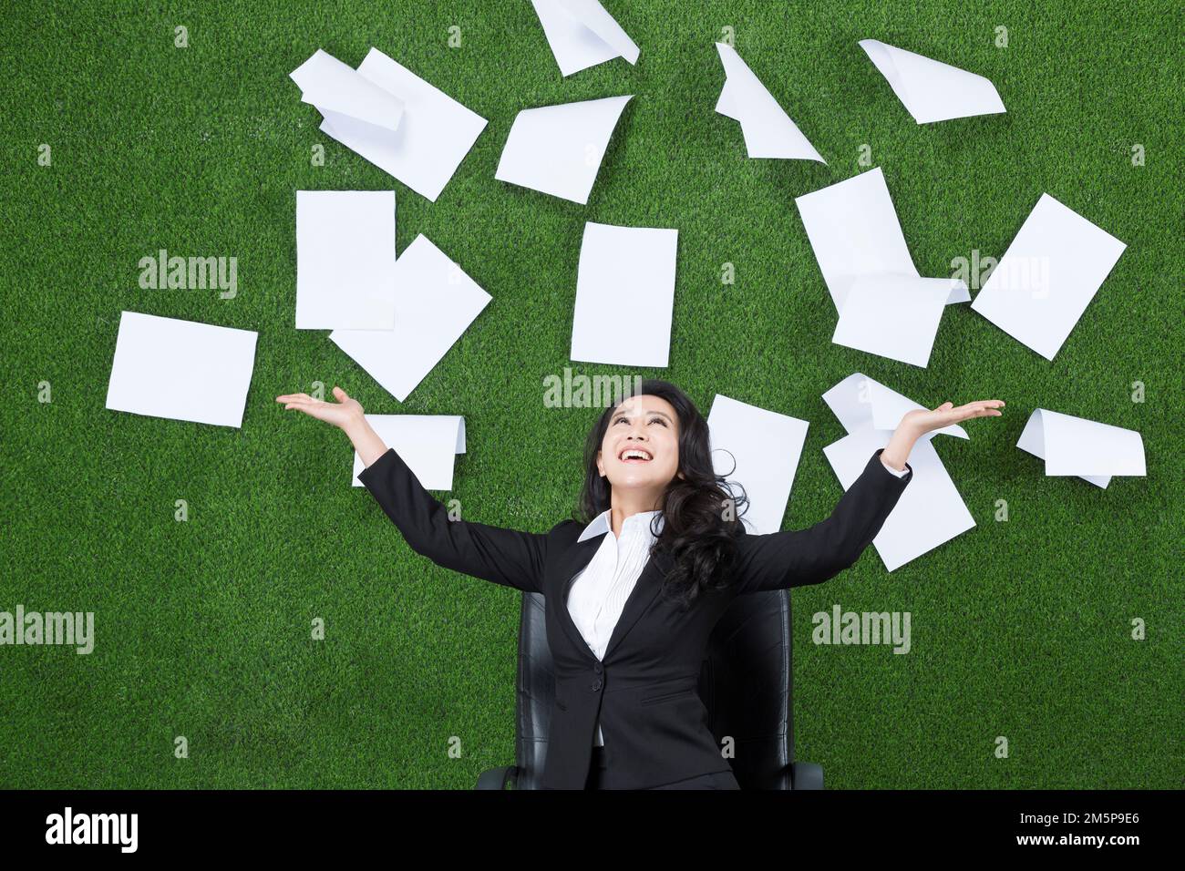 Ms grass business paper thrown into the air Stock Photo - Alamy