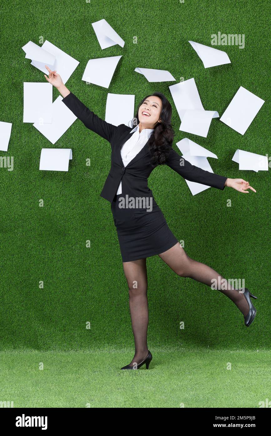 Ms grass business paper thrown into the air Stock Photo - Alamy
